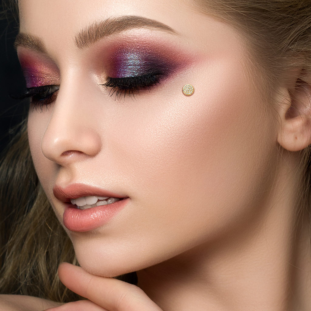 Bright eye-catching dermal top made of solid 14k gold