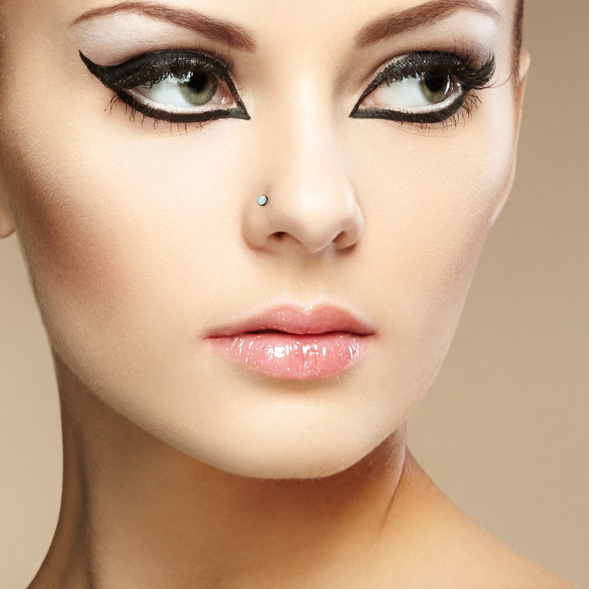 Pretty nose stud with an opal stone and rounded end